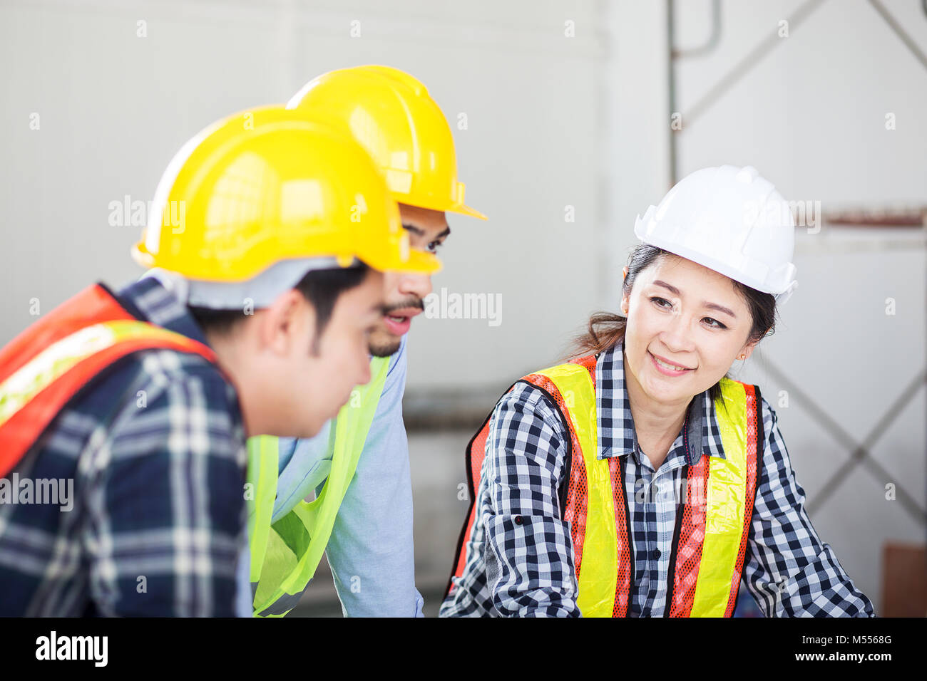 Group engineers architects working together hi-res stock photography ...
