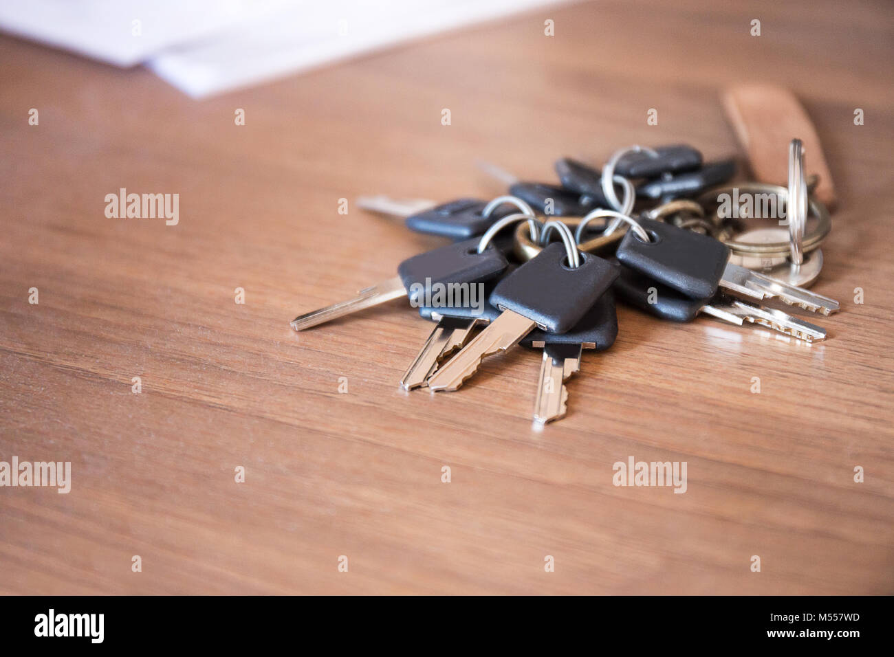 A lot of key chain on desk office with meeting document Stock Photo - Alamy