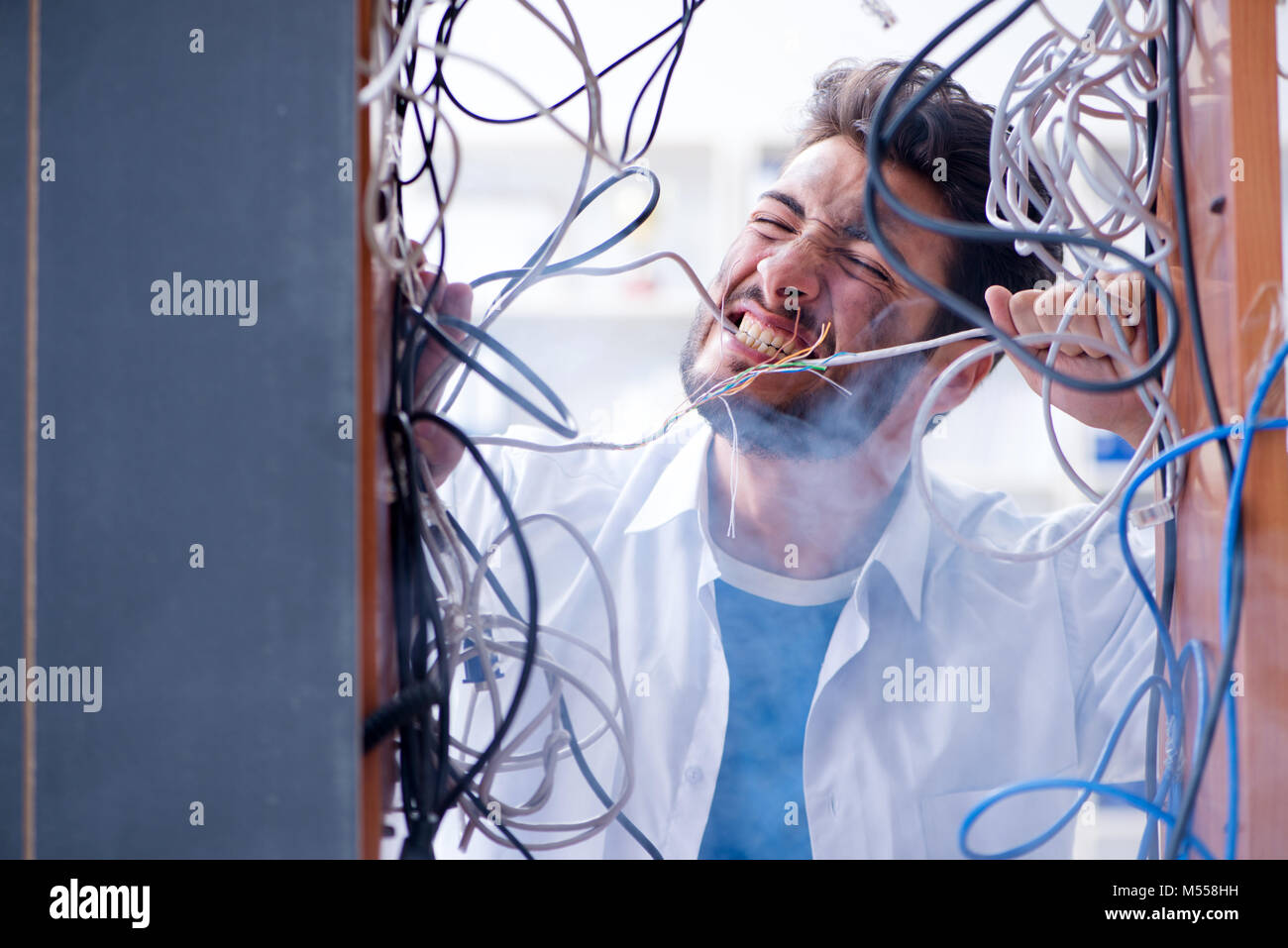 The computer repairman working on repairing network in it workshop ...