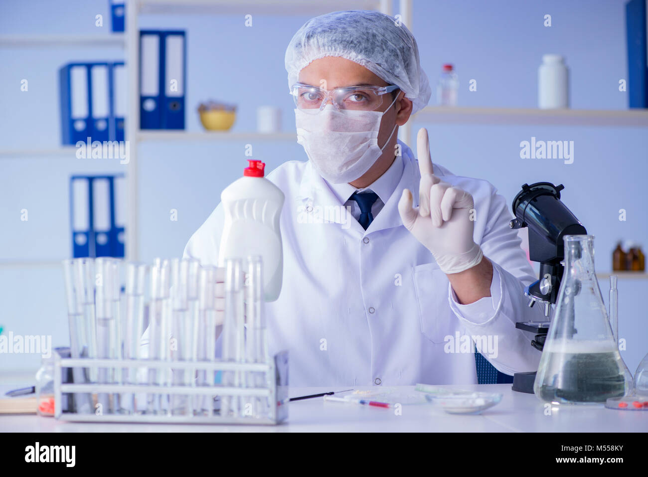 The man in the lab testing new cleaning solution detergent Stock Photo ...