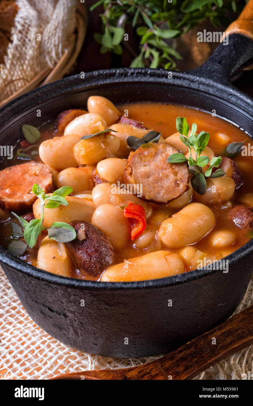 Polish Baked Beans with sausage Stock Photo - Alamy