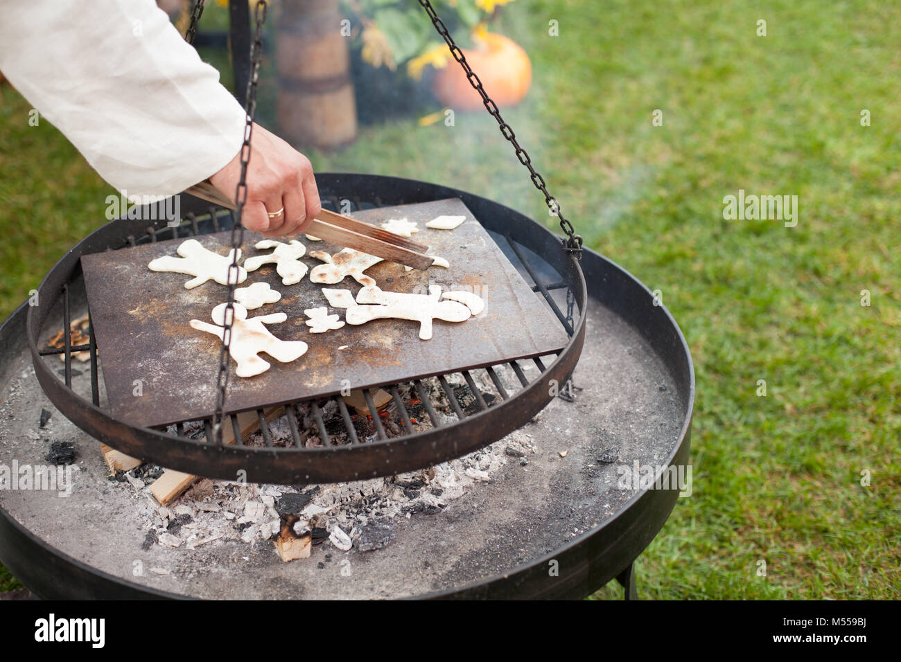 flatbread - a cake made of flour and water, baking over a fire Stock ...