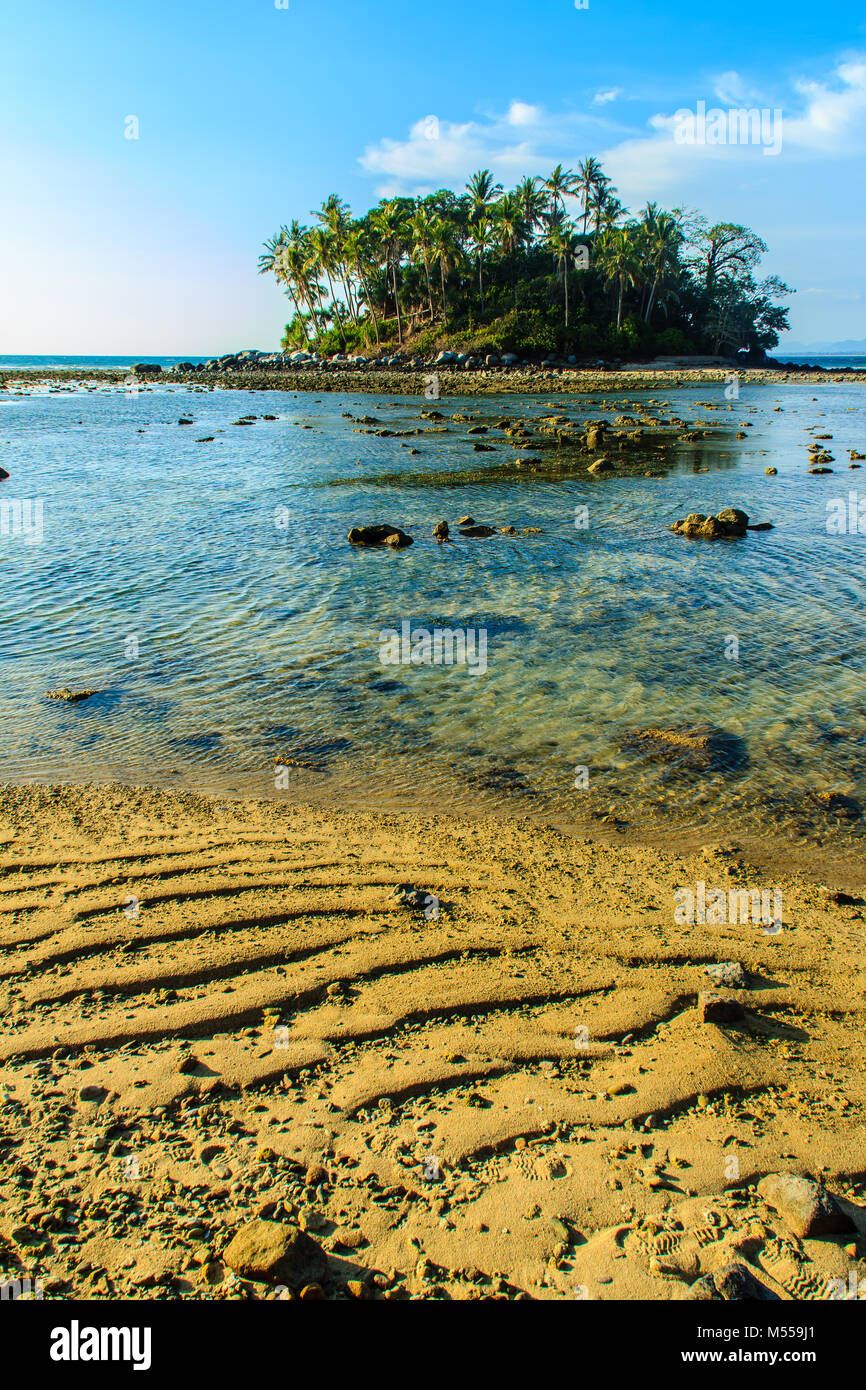 Lonely remote island with rock beach and tree when the sea water ...