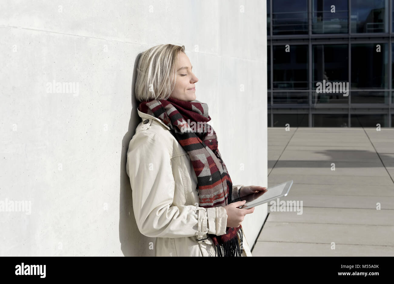 relaxed young woman with digital tablet Stock Photo - Alamy