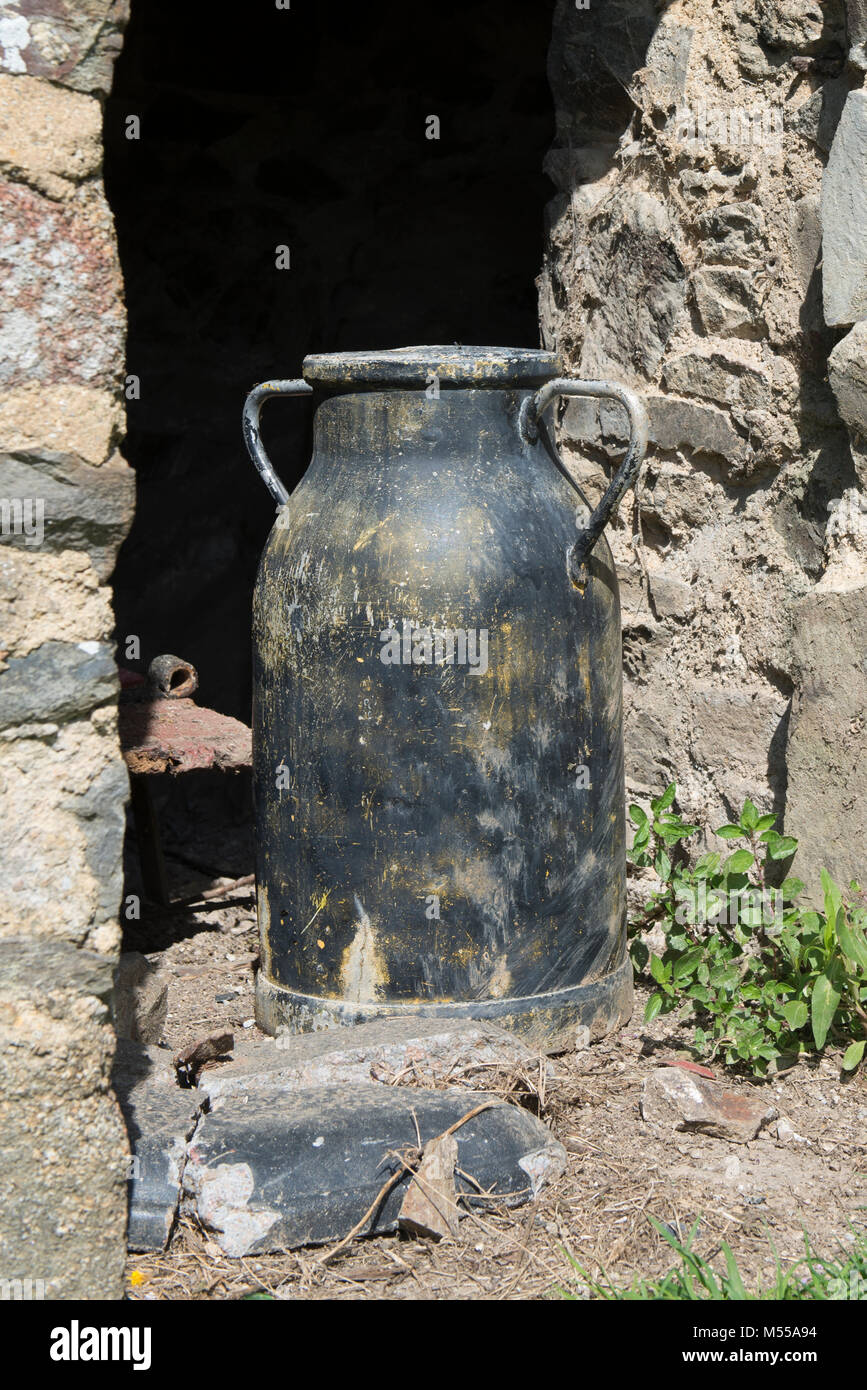 An old milk churn beside the city walls in Fougeres, France Stock Photo ...