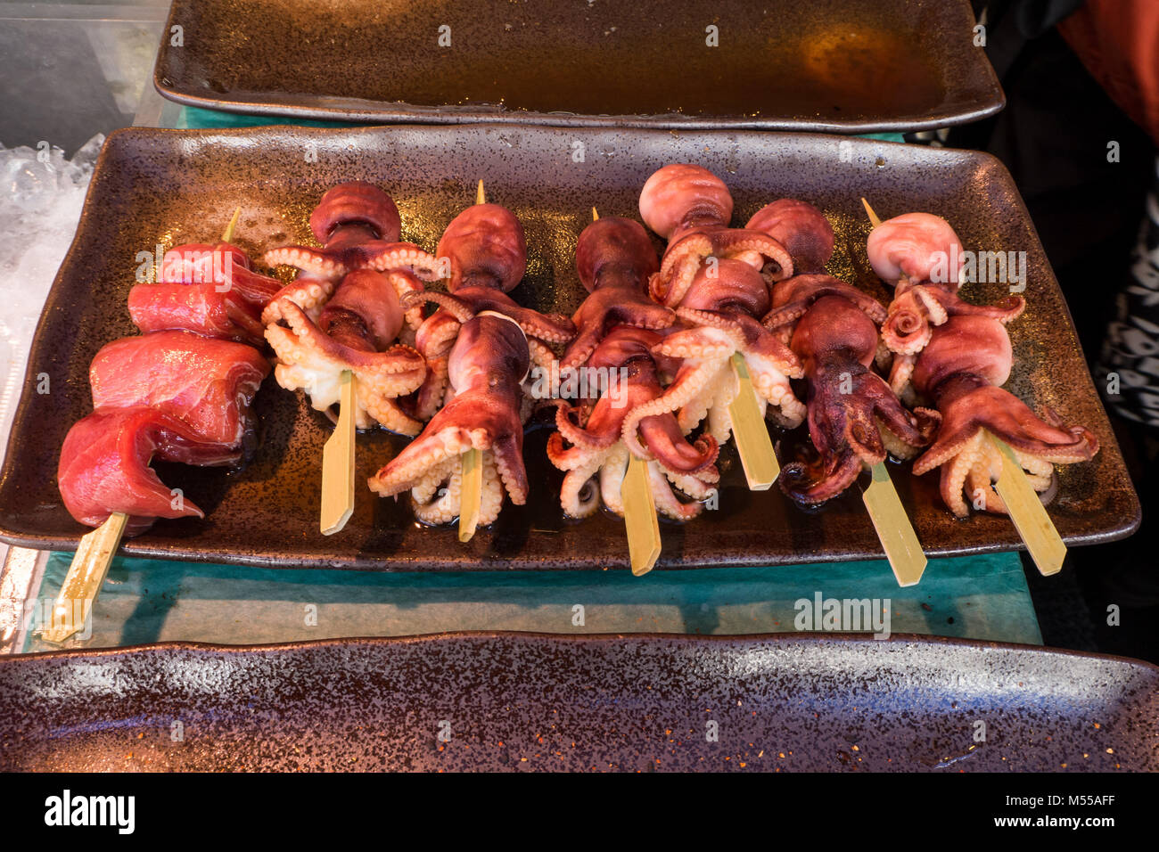 Octopus skewers steamed cooked Stock Photo - Alamy