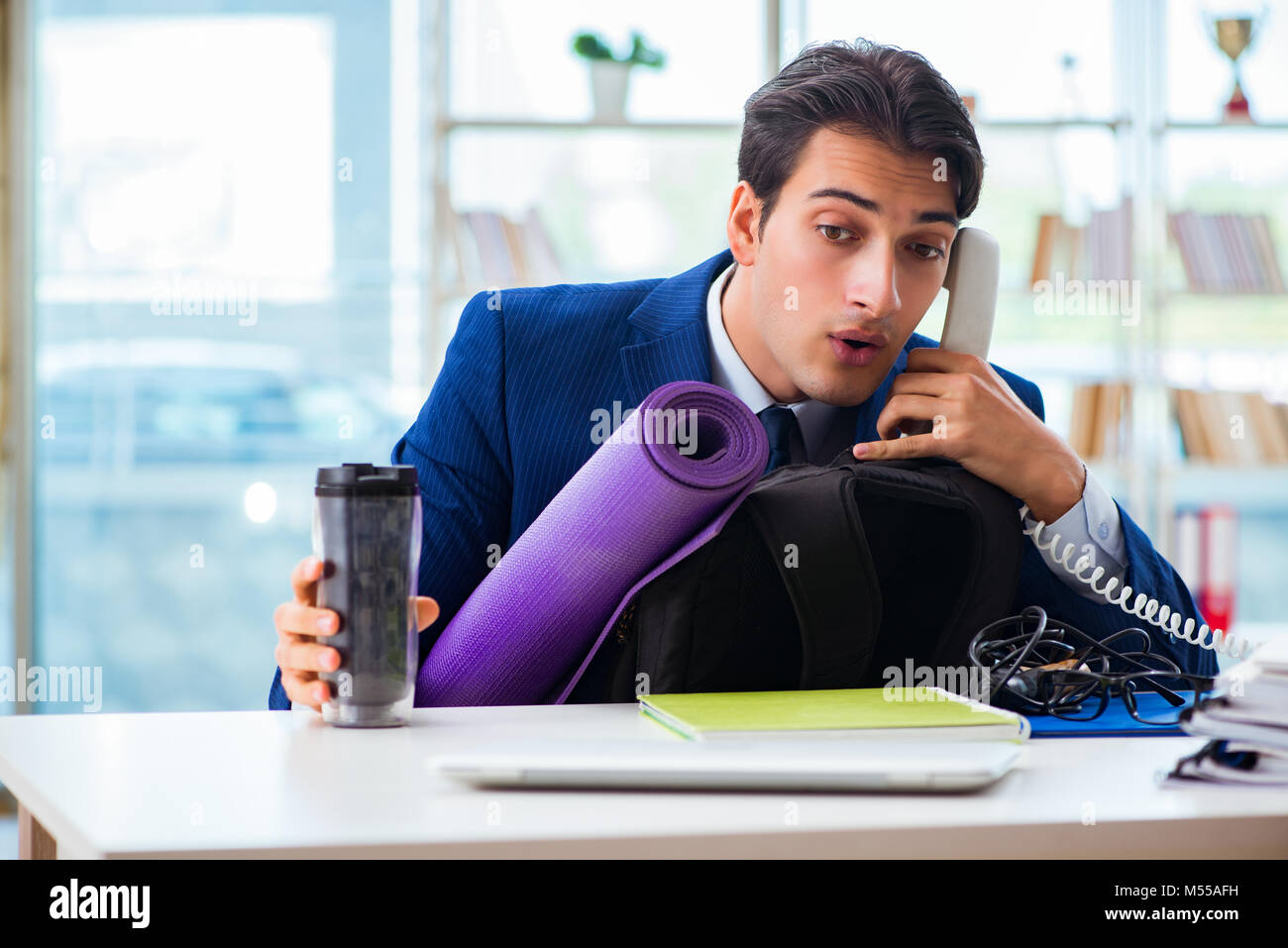 Man getting ready for sports break in the office Stock Photo - Alamy