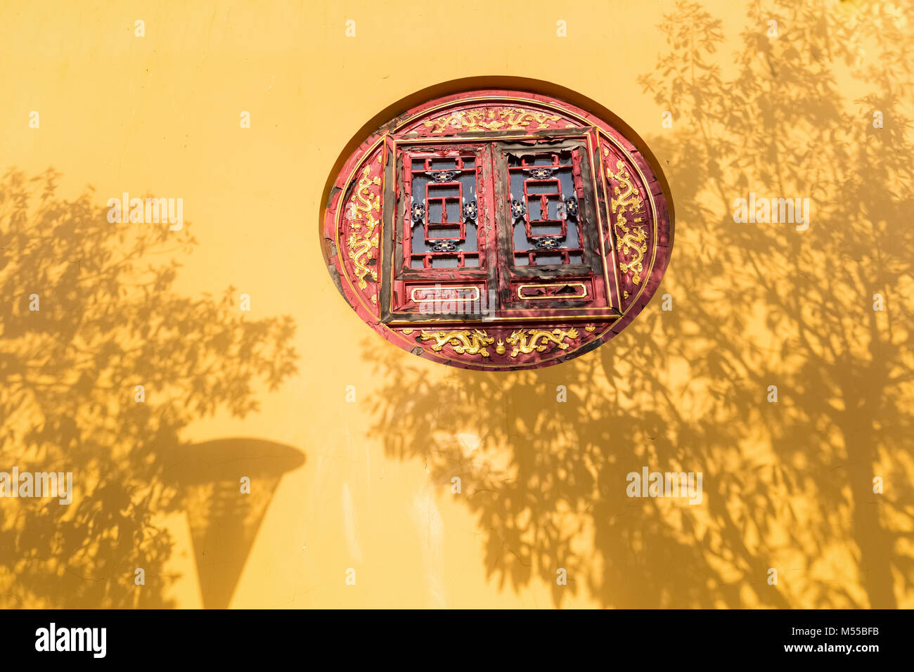 Tree shadow on red hi-res stock photography and images - Alamy