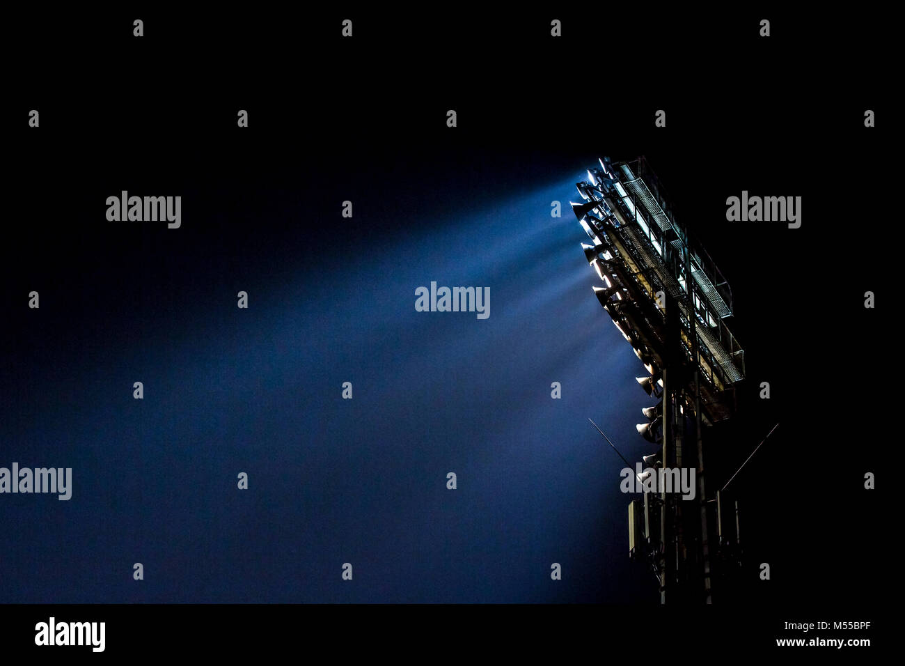 Big spotlights lighting tower at an sport arena stadium Stock Photo - Alamy