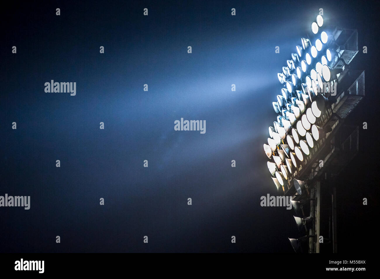 Big spotlights lighting tower at an sport arena stadium Stock Photo - Alamy