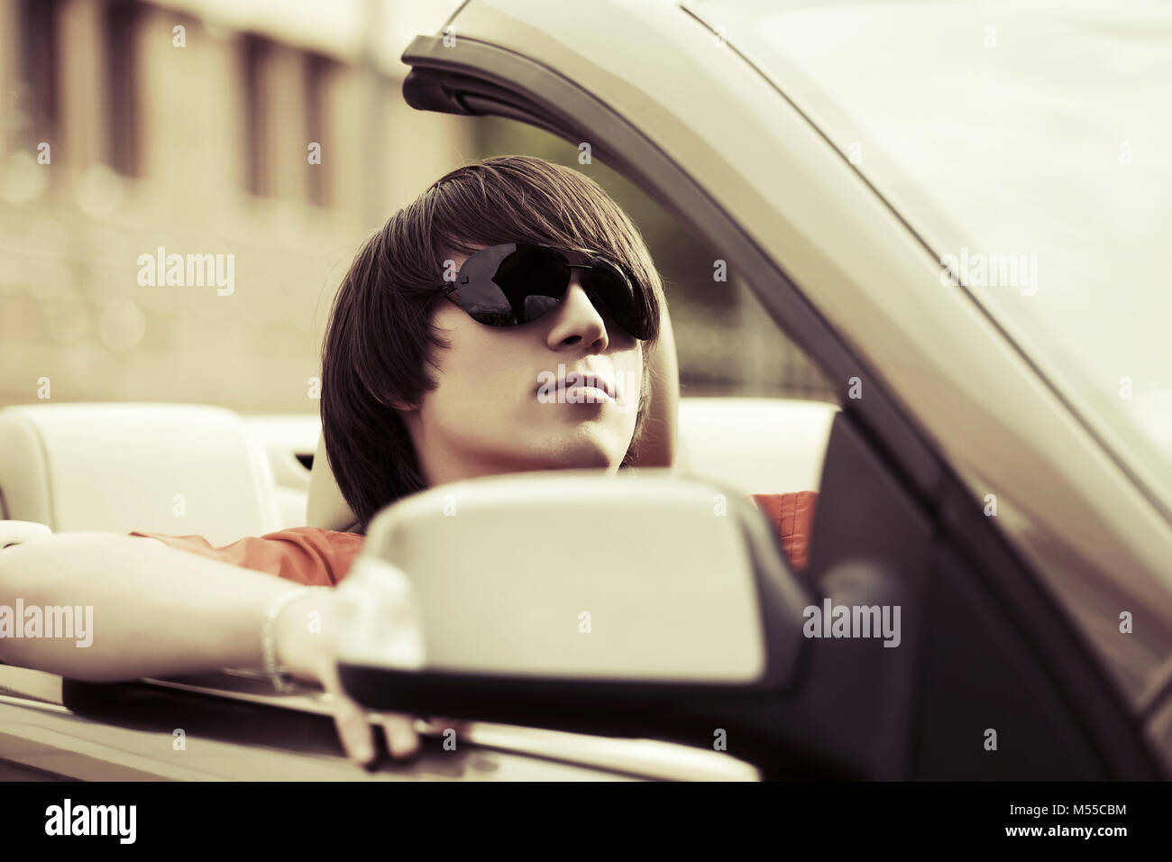Young handsome fashion man driving convertible car Stock Photo - Alamy