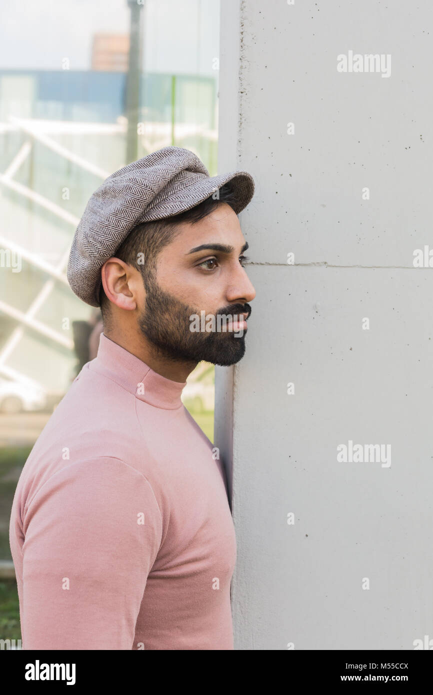 Handsome Indian man posing in an urban context. Street fashion and ...
