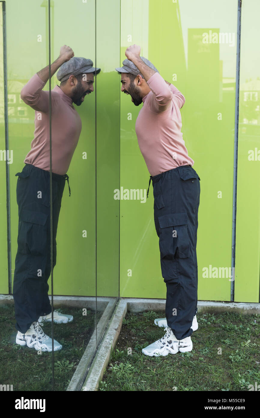 Handsome man in front mirror hi-res stock photography and images - Alamy