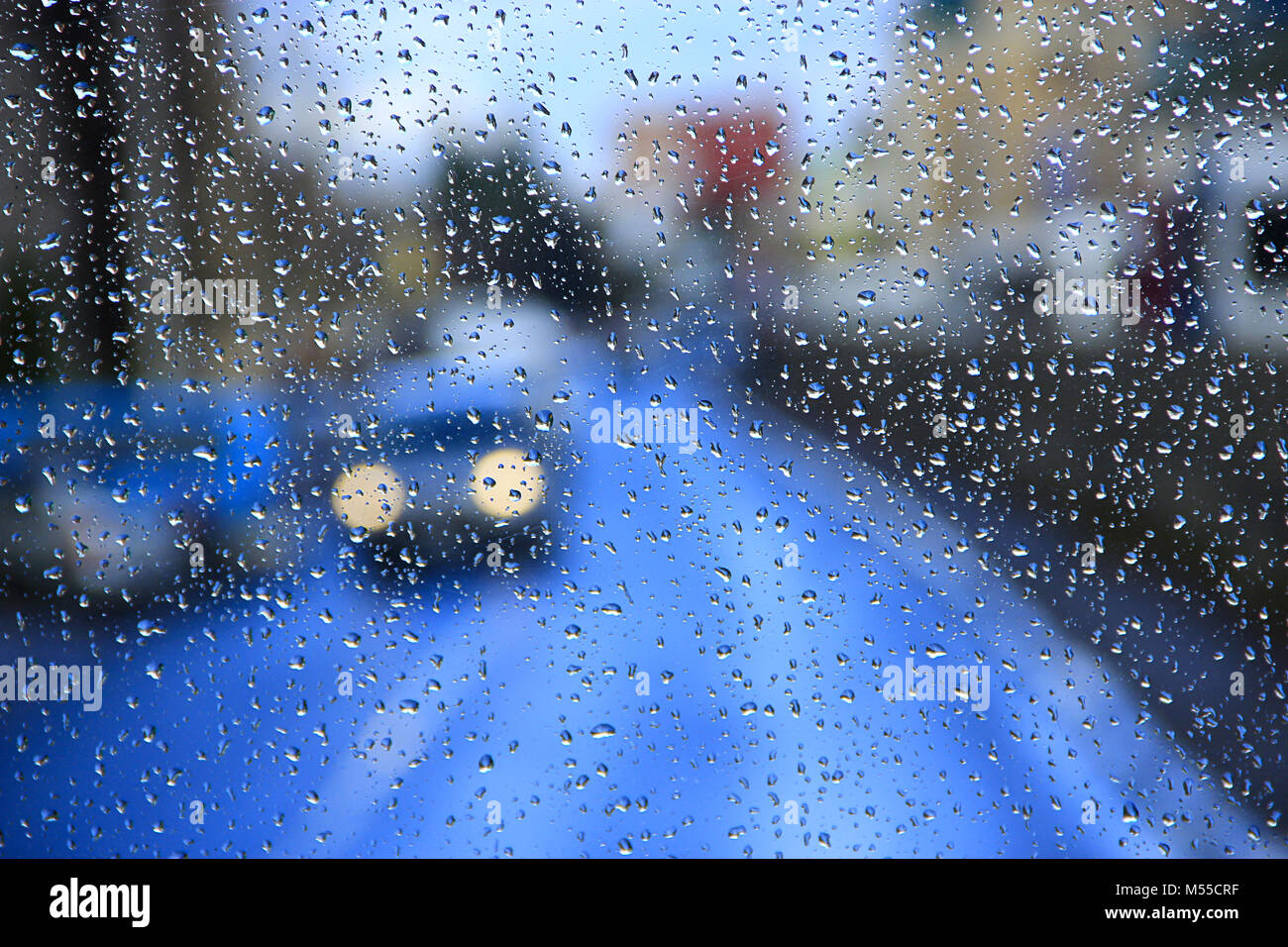 it's raining behind the window in the city Stock Photo - Alamy