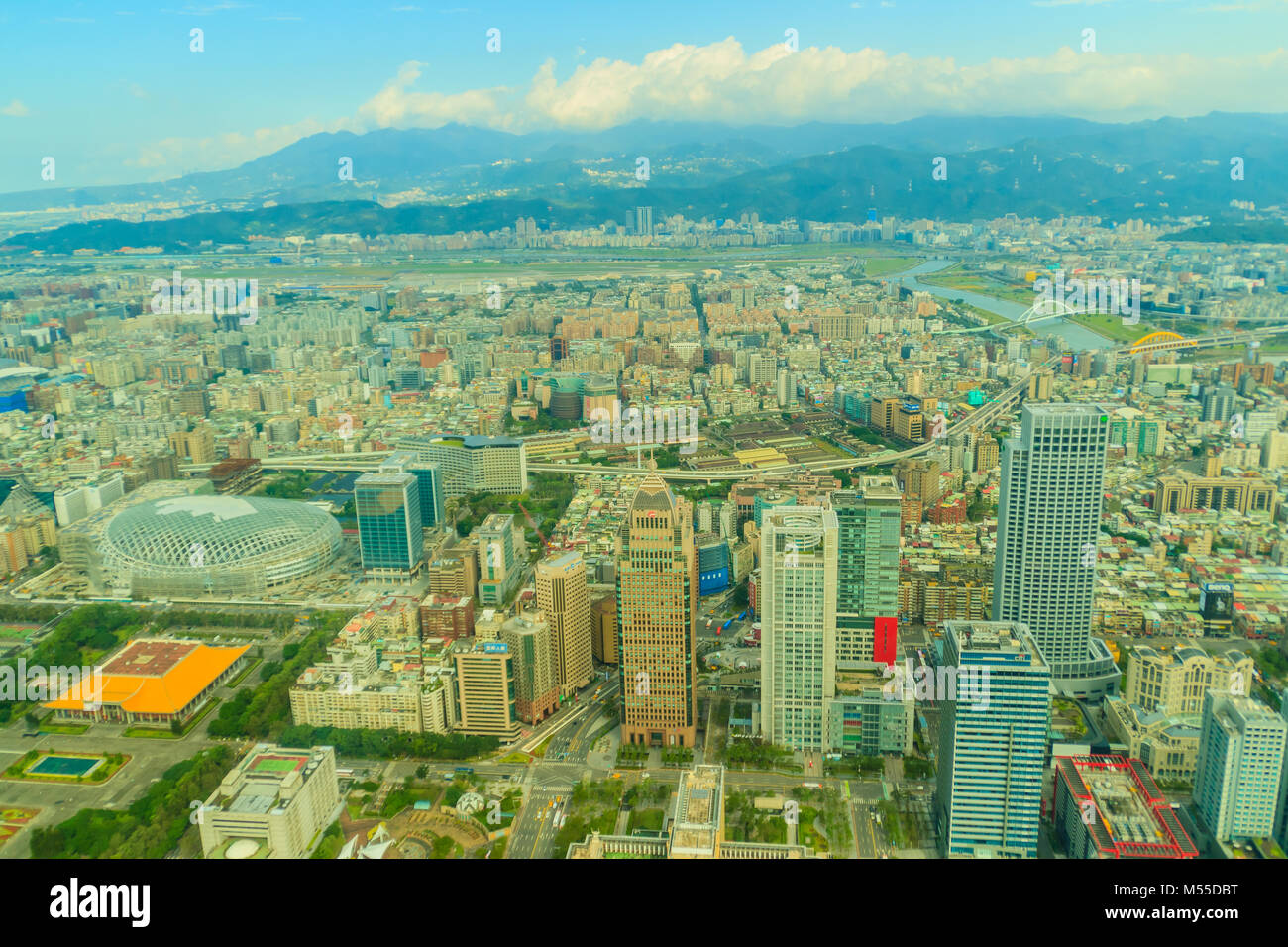 Aerial panorama over Taipei, capital City of Taiwan, on a blue sky and ...