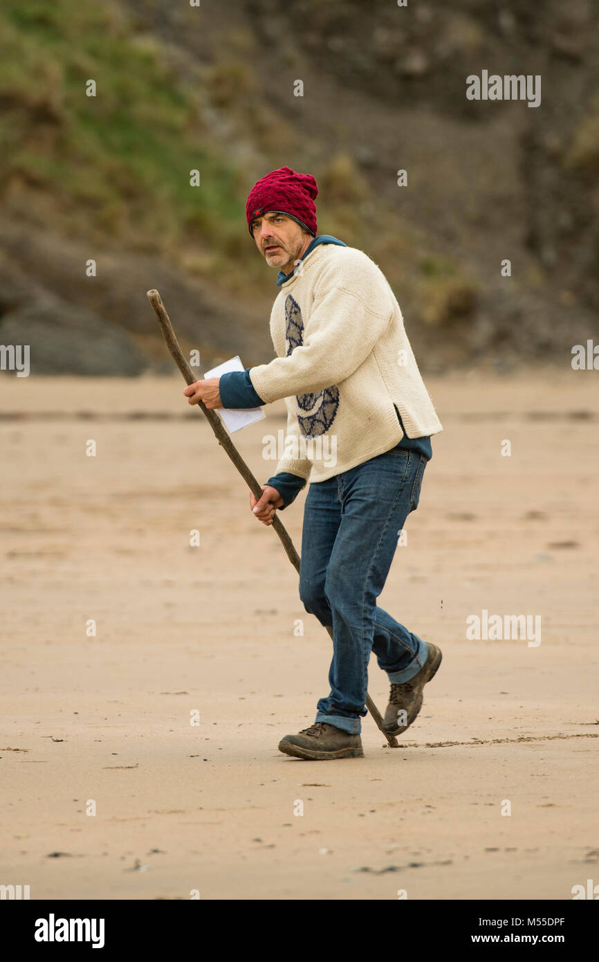 MARC TREANOR, sand artist, working on one of his huge , but ephemeral ...