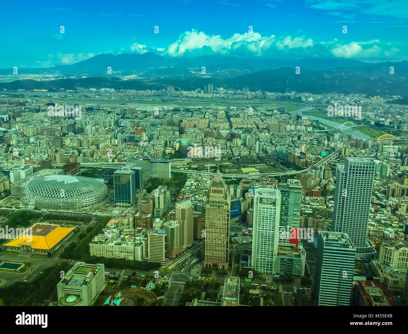 Aerial panorama over Taipei, capital City of Taiwan, on a blue sky and ...
