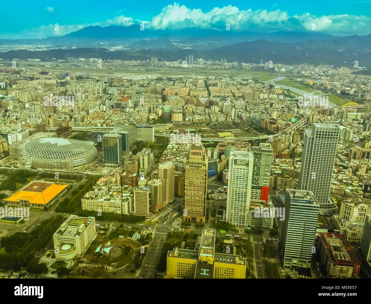 Aerial panorama over Taipei, capital City of Taiwan, on a blue sky and ...