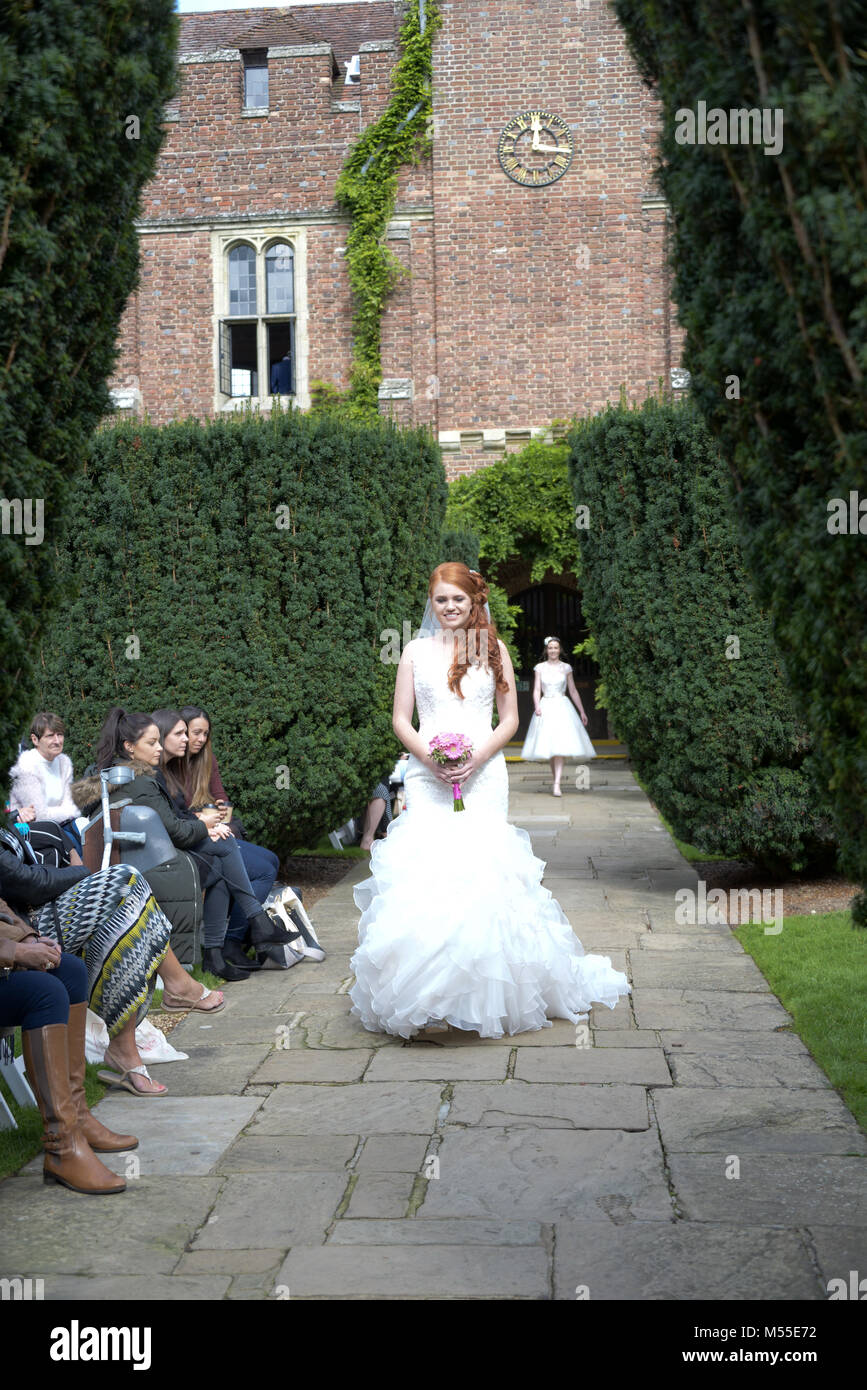 Beautiful Models wearing Bridal wear are walking on a catwalk at ...