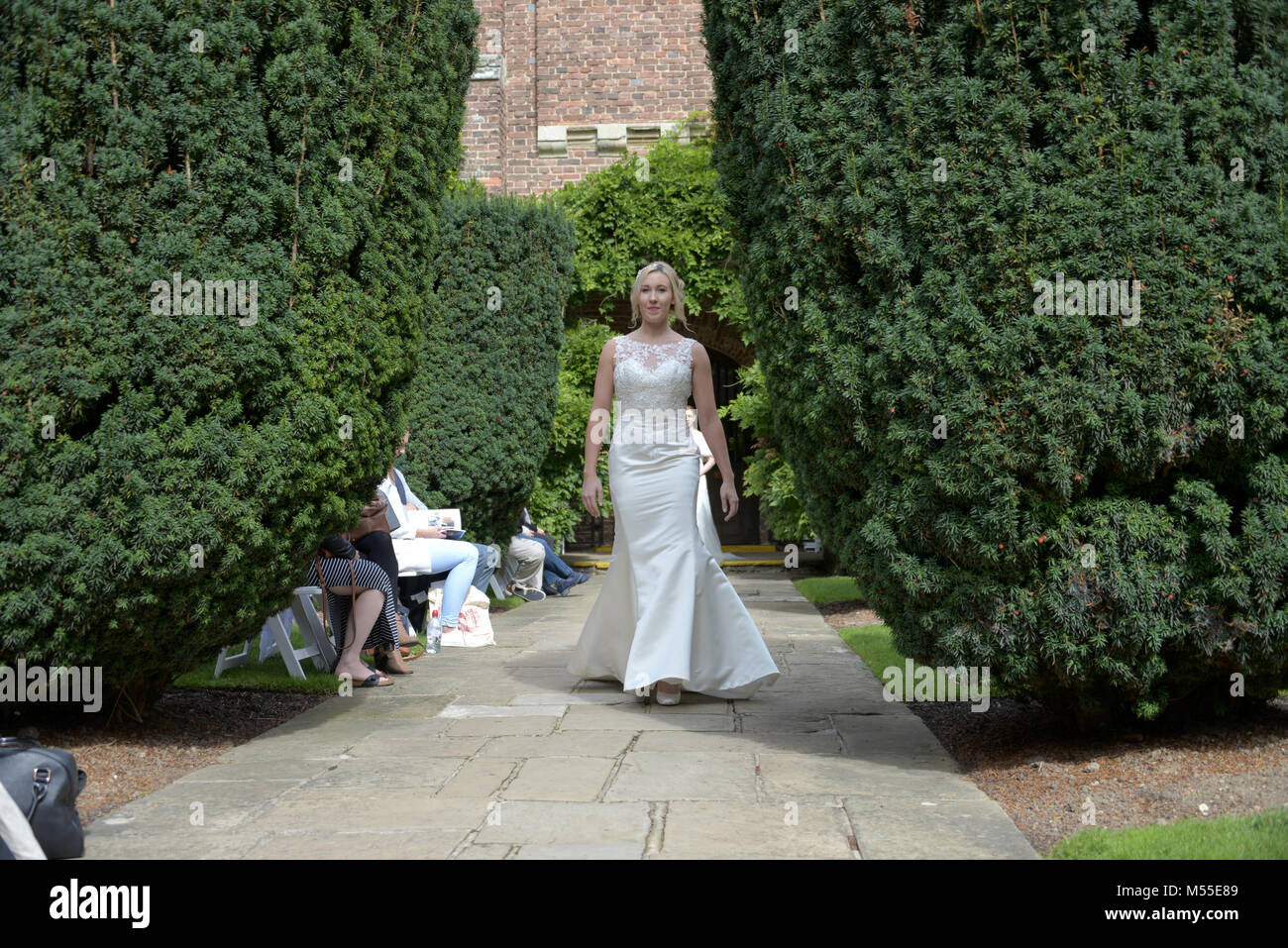 Beautiful Models wearing Bridal wear are walking on a catwalk at ...
