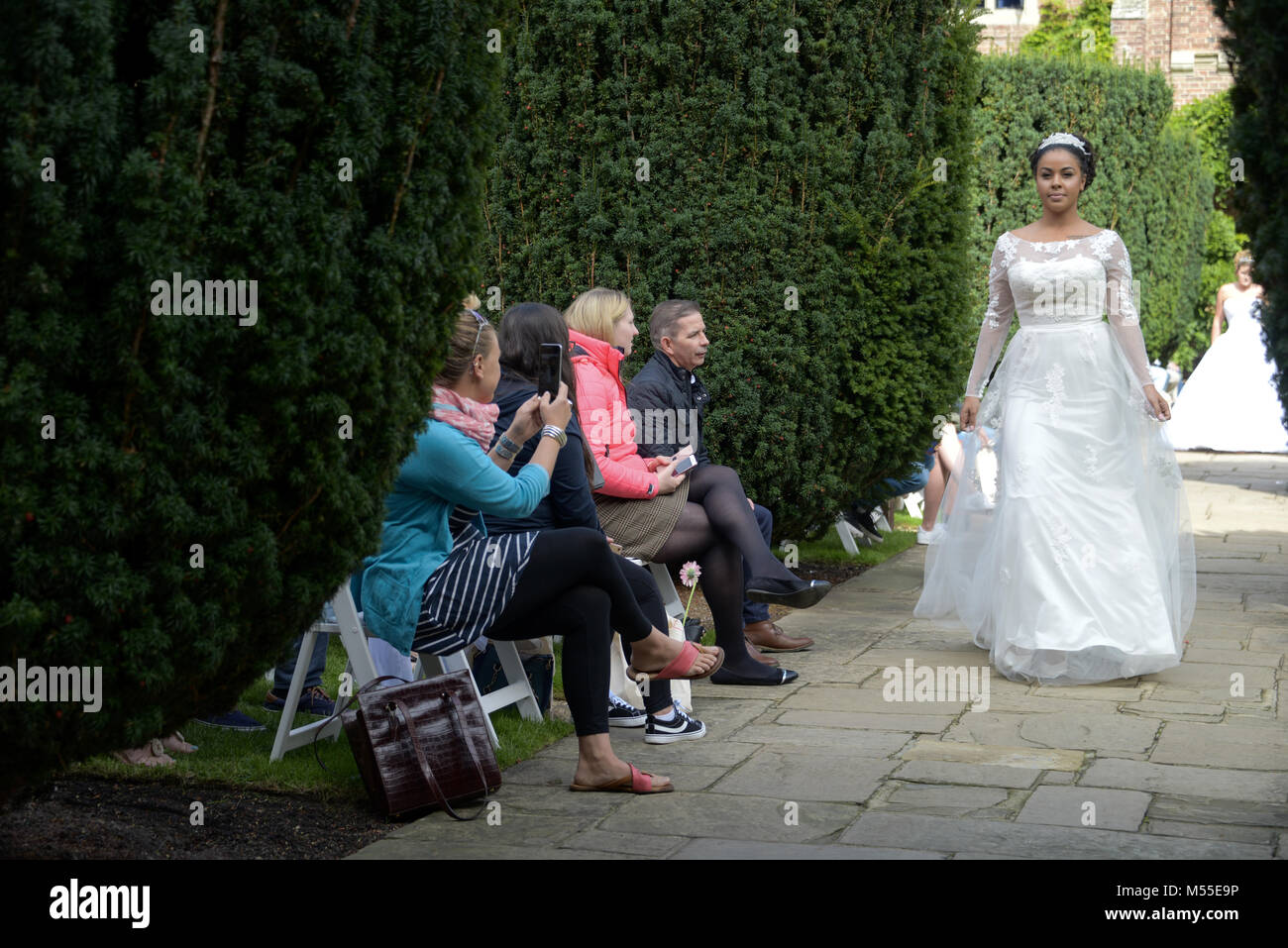 Beautiful Models wearing Bridal wear are walking on a catwalk at ...