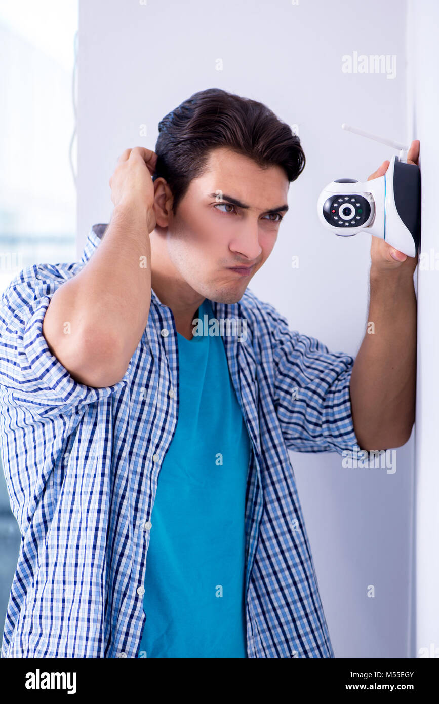Man installing surveillance CCTV cameras at home Stock Photo - Alamy