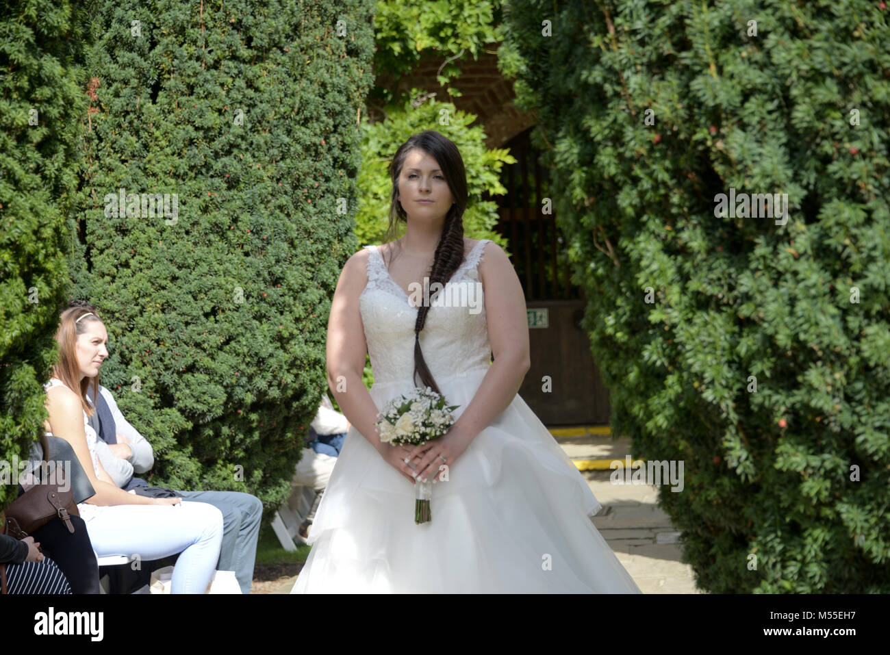Beautiful Models wearing Bridal wear are walking on a catwalk at ...
