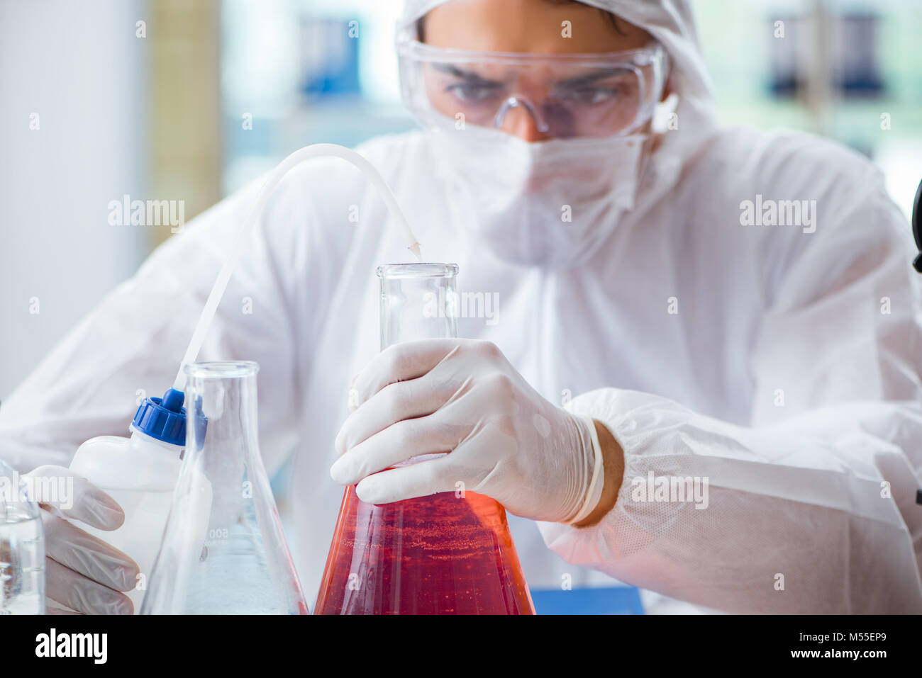 Chemist working in the laboratory with hazardous chemicals Stock Photo ...