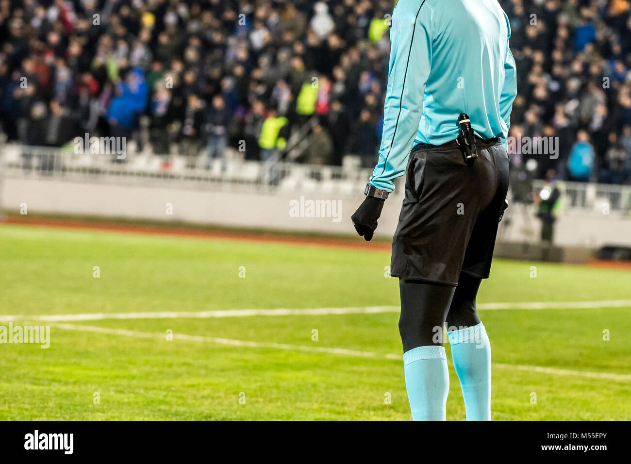 Assistant referees signalling on the sideline during a soccer match ...