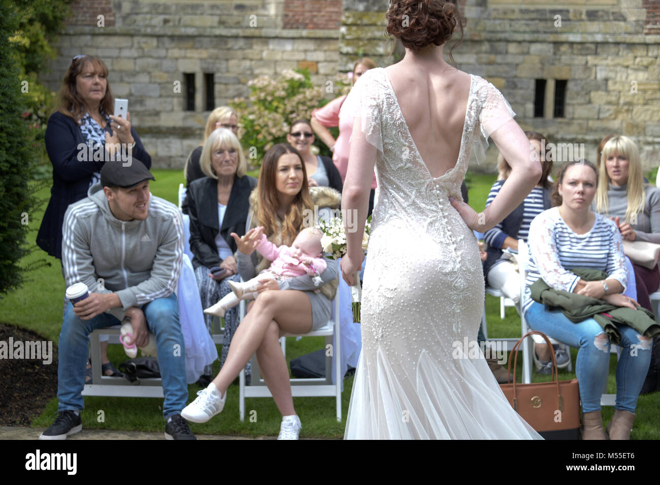 Beautiful Models wearing Bridal wear are walking on a catwalk at ...