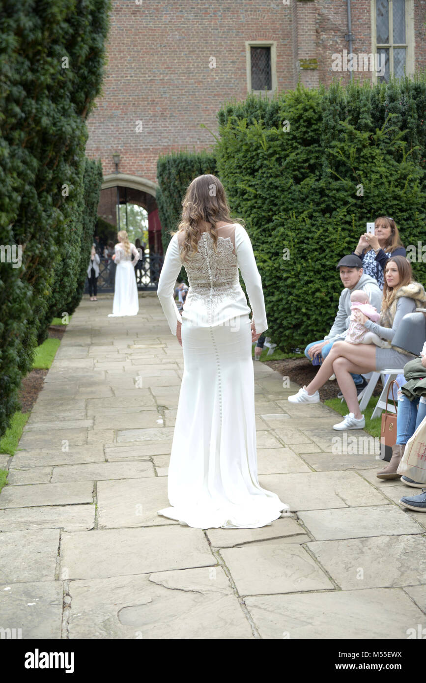 Beautiful Models wearing Bridal wear are walking on a catwalk at ...
