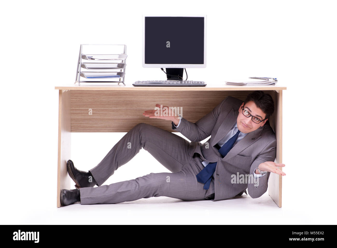 Person hiding under desk hi-res stock photography and images - Alamy