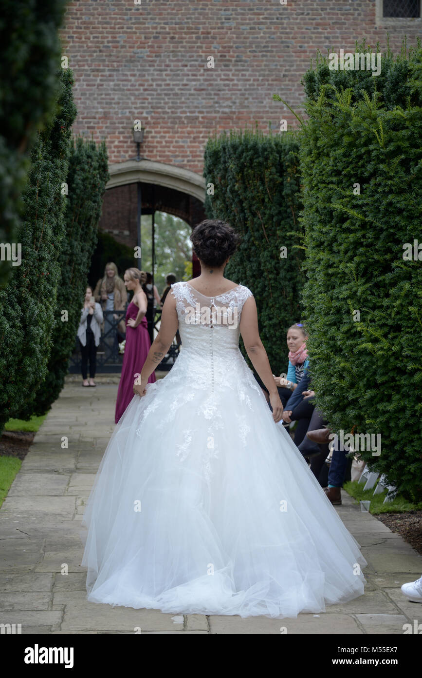 Beautiful Models wearing Bridal wear are walking on a catwalk at ...