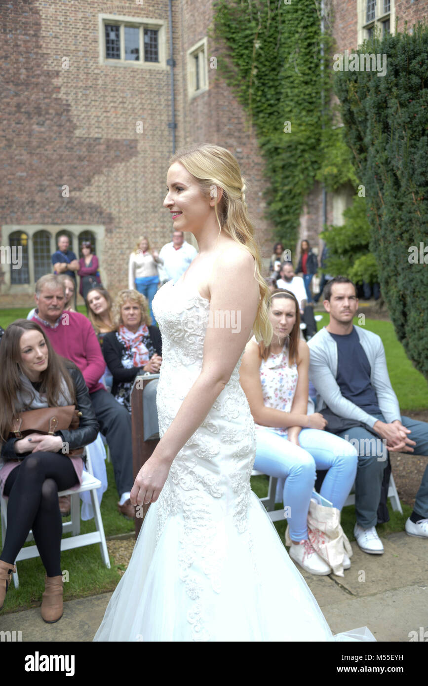 Beautiful Models wearing Bridal wear are walking on a catwalk at ...