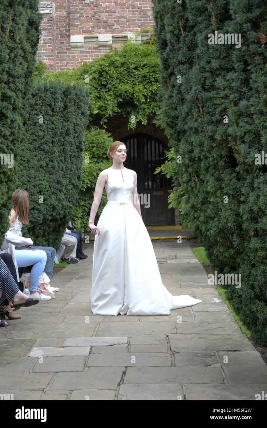 Beautiful Models wearing Bridal wear are walking on a catwalk at ...
