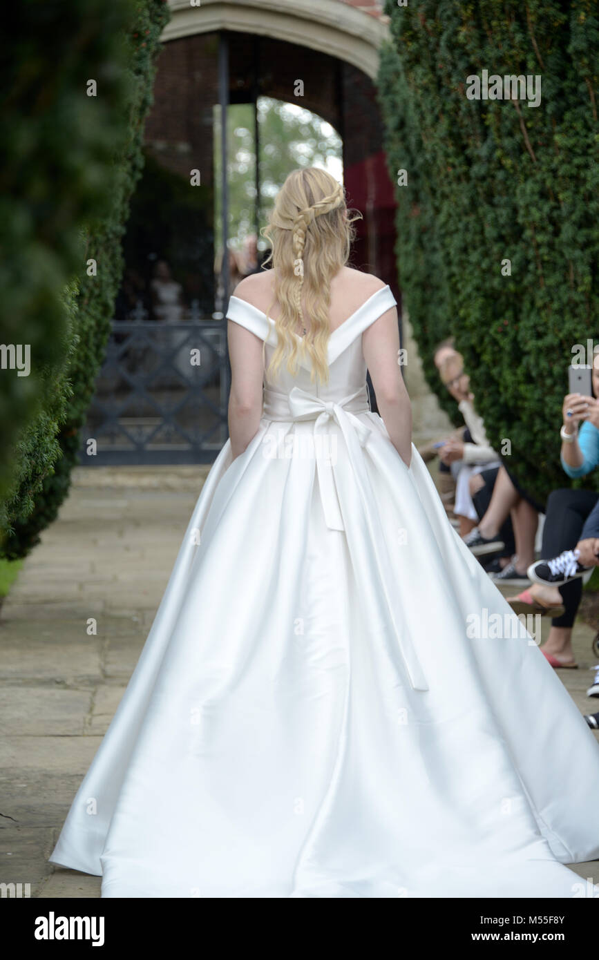 Beautiful Models wearing Bridal wear are walking on a catwalk at ...