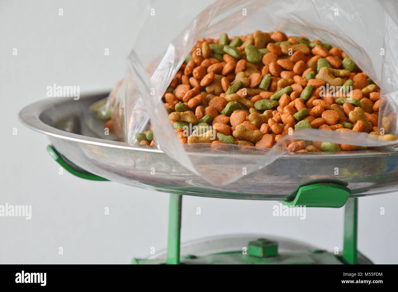 dog food in plastic bag on weighing scale tray Stock Photo - Alamy