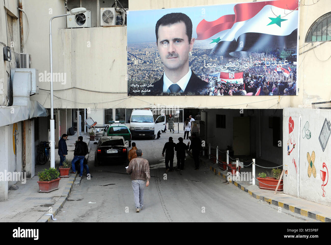 Damascus. 20th Feb, 2018. A giant poster of President Bashar al-Assad ...