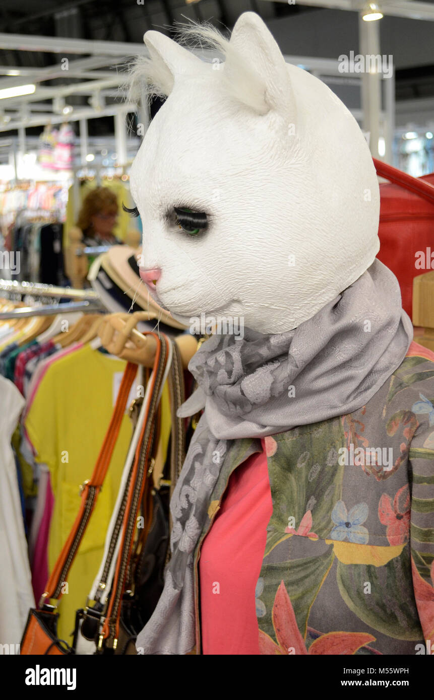 Clothes displayed on a mannequin with a cat's head at Moda. The trade ...