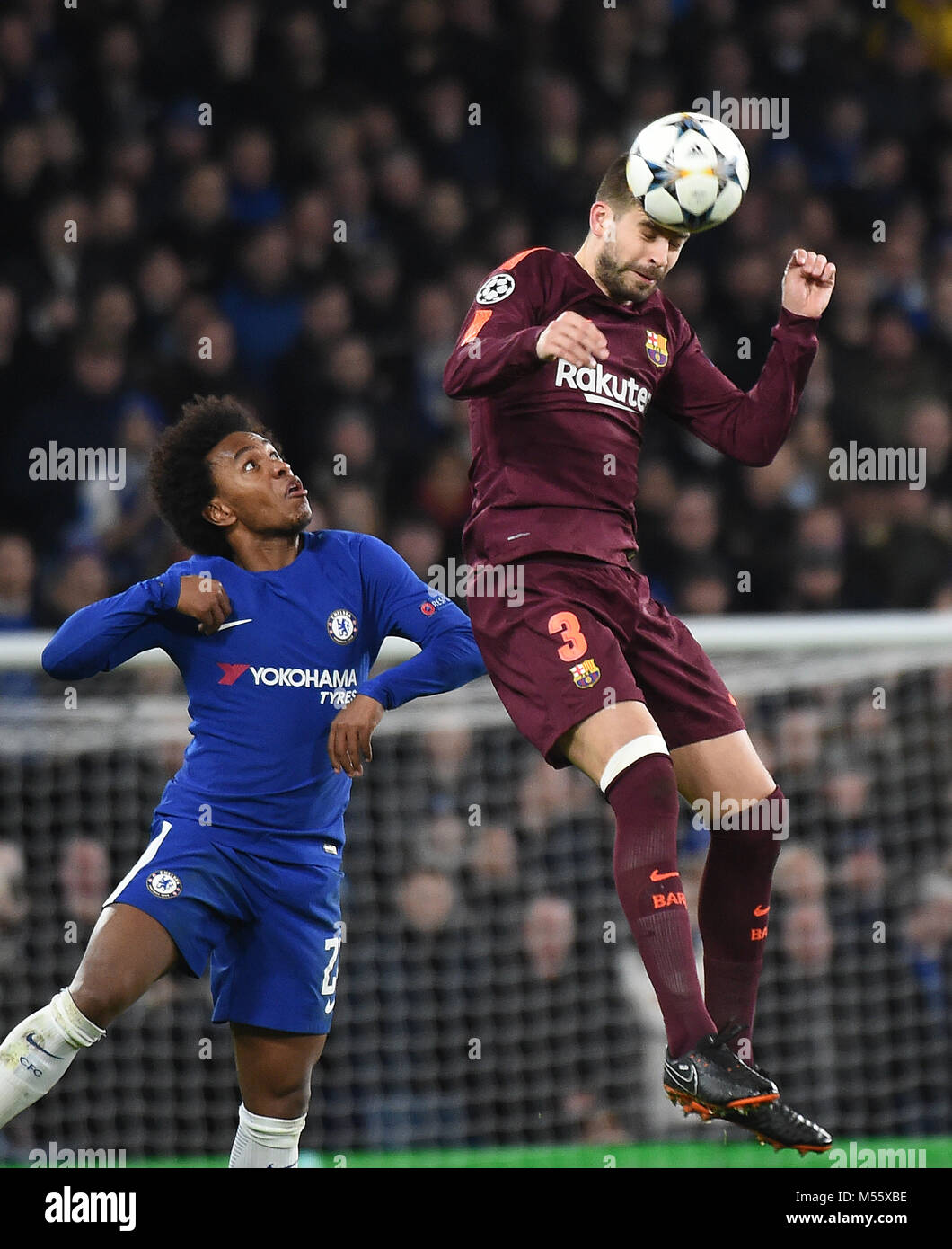 London, UK. 20th Feb, 2018. Willian of Chelsea and Gerard Pique of ...