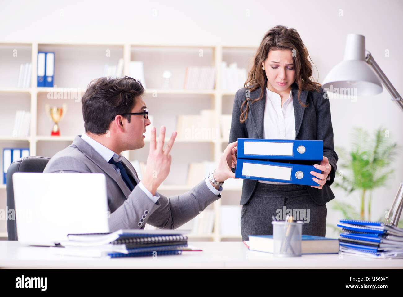 Angry boss unhappy with female employee performance Stock Photo - Alamy