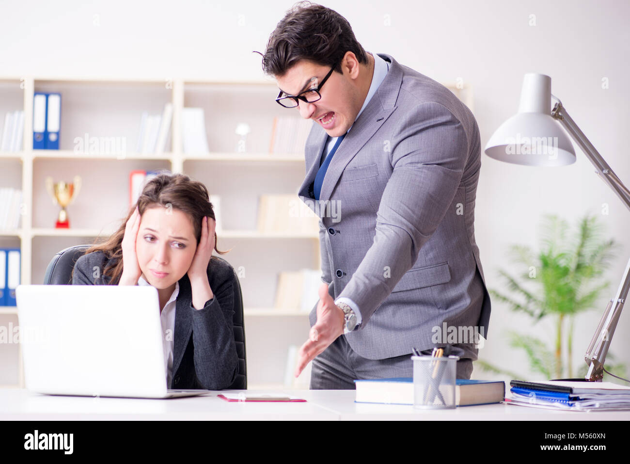 Angry boss unhappy with female employee performance Stock Photo - Alamy