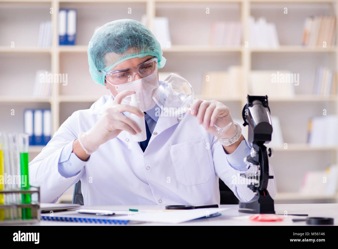 Forensics investigator working in lab on crime evidence Stock Photo - Alamy