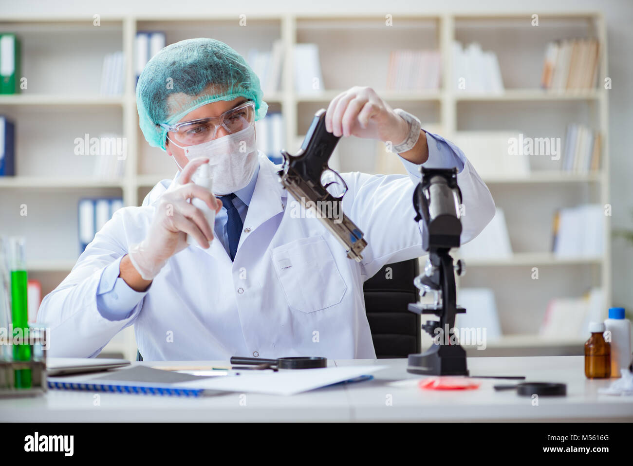 Forensics investigator working in lab on crime evidence Stock Photo - Alamy