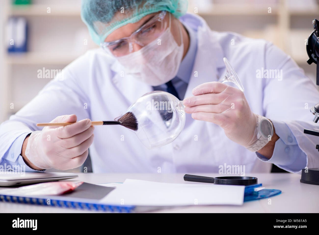 Forensics investigator working in lab on crime evidence Stock Photo - Alamy