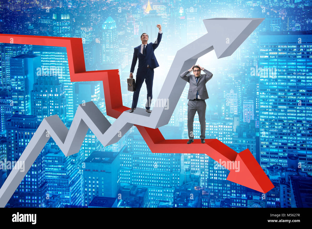 Businessman with charts of growth and decline Stock Photo - Alamy