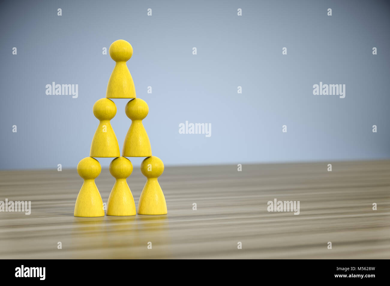 game figures building a pyramid Stock Photo - Alamy