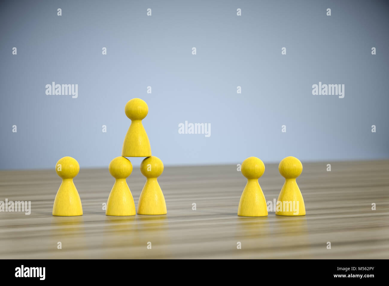 game figures building a pyramid Stock Photo - Alamy