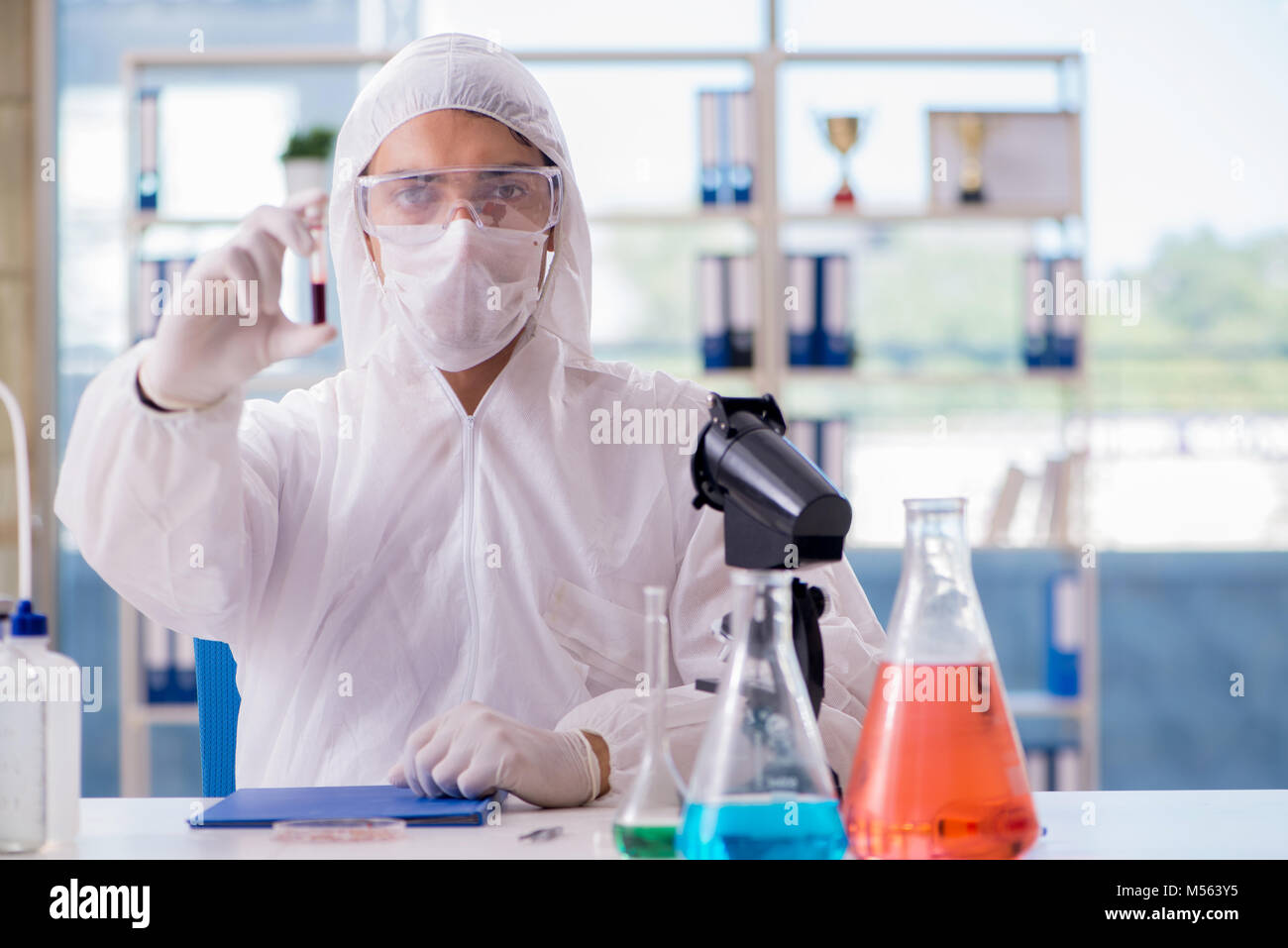 Chemist working in the laboratory with hazardous chemicals Stock Photo ...