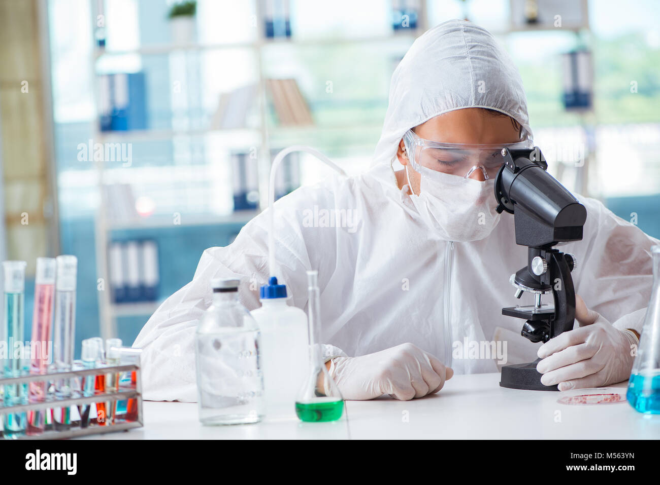 Chemist working in the laboratory with hazardous chemicals Stock Photo ...